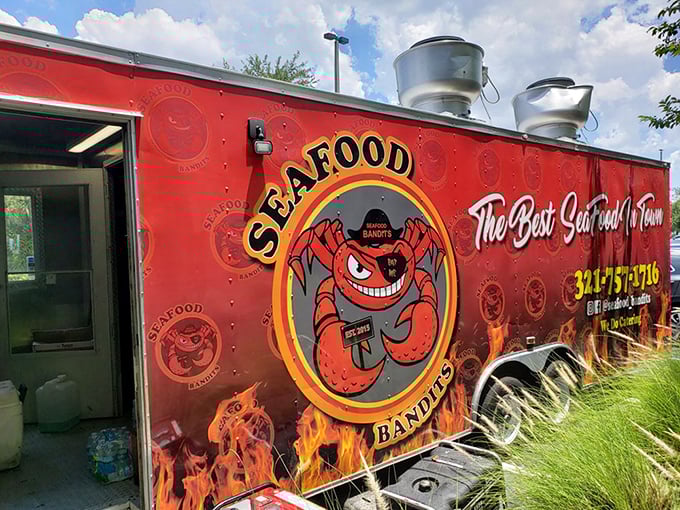 The back of the truck reveals the Bandits' true identity—a smiling crab mascot who looks like he's plotting delicious crimes against your diet. 