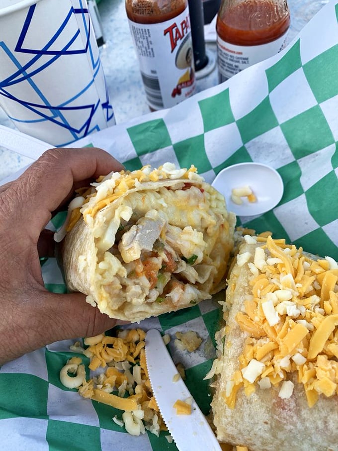 A seafood burrito that's practically bursting at the seams – like your favorite aunt who always overpacks for weekend trips but brings exactly what you need.