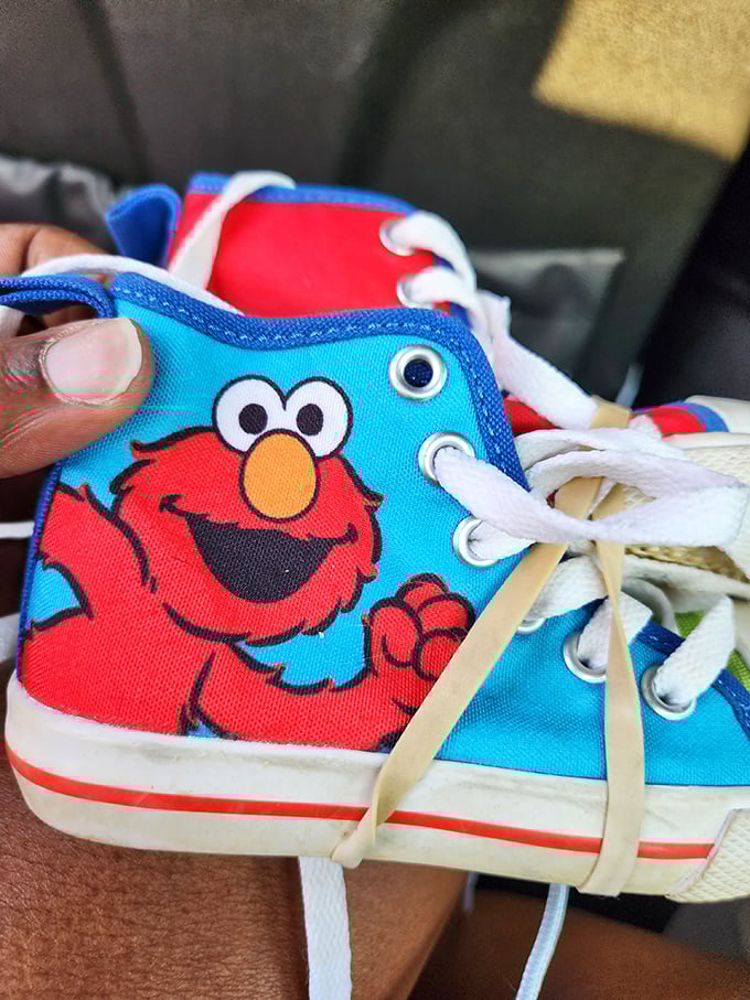 These Elmo high-tops aren't just kids' shoes – they're childhood joy waiting to be rediscovered, complete with the kind of character that money usually can't buy.