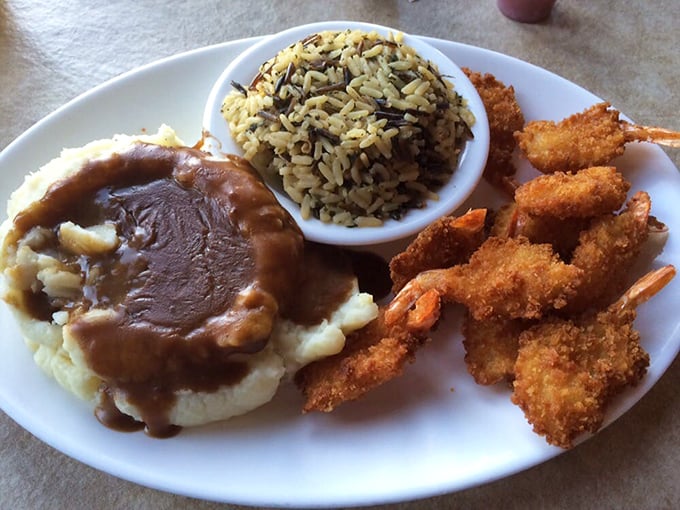Breaded shrimp crowning a mountain of mashed potatoes—surf meets turf in the most delicious diplomatic summit ever.