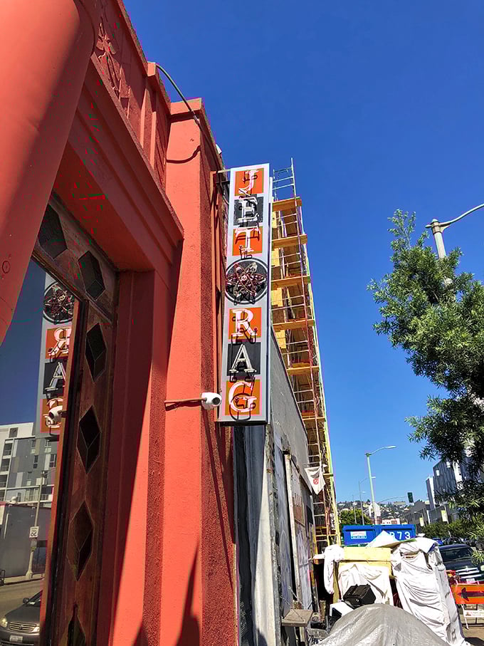 The vertical signage draws the eye upward, much like the elevated pulse of shoppers who've just spotted the perfect vintage find inside.