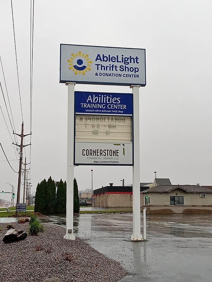 The roadside sign announces not just a thrift store but an Abilities Training Center – shopping with purpose in every purchase.
