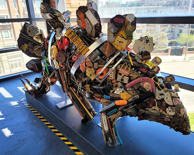 A sculpture assembled from found objects creates a striking silhouette against Baltimore's skyline—proof that one person's junk is another's masterpiece.