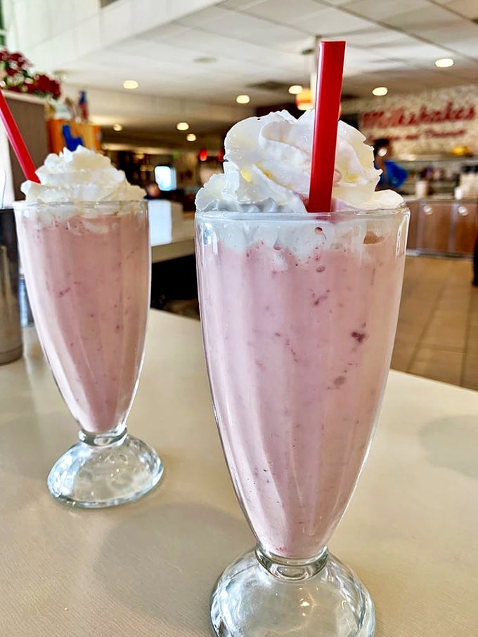 Strawberry shakes topped with whipped cream mountains—dessert masquerading as a beverage and fooling absolutely no one.