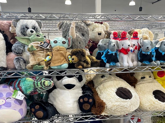 Stuffed animals patiently waiting for their next cuddle, including that Baby Yoda who's seen better days but still has plenty of Force left.