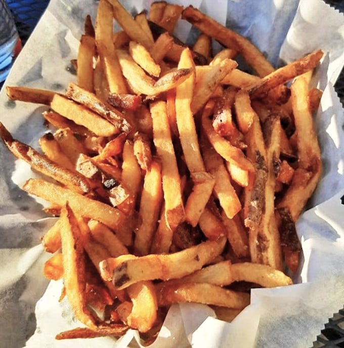 Hand-cut fries that achieve the golden trifecta: crispy exterior, fluffy interior, and just enough salt to make you reach for your beer.