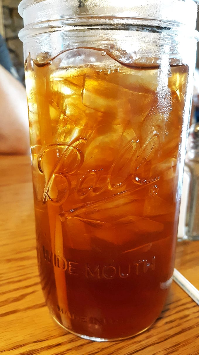 Sweet tea in a mason jar – because in Tennessee, this amber nectar flows freely and tastes like liquid Southern hospitality.