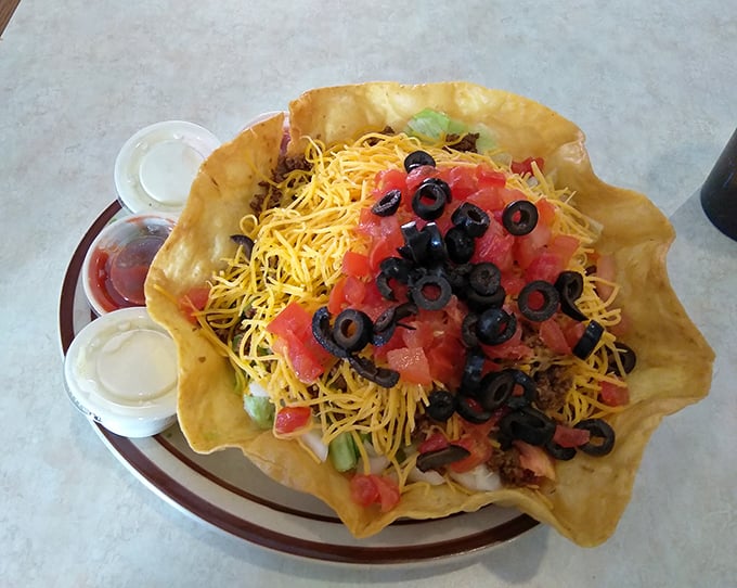 A taco salad that defies physics with its perfectly formed tortilla bowl. The ultimate edible dishware – Mother Nature's original zero-waste container.