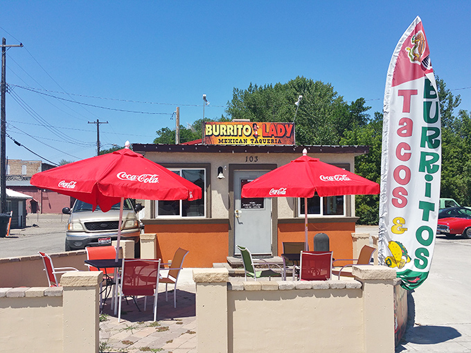 The Burrito Lady's cheerful stand offers a splash of color and flavor, where red umbrellas invite you to sit a spell and savor authentic Mexican treats.