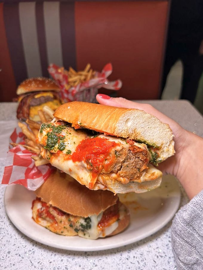 This isn't just a sandwich—it's a meatball masterpiece that requires both hands, several napkins, and absolutely no shame.