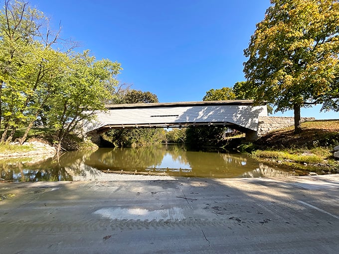 The bridge's reflection doubles the beauty—nature's own Instagram filter working its magic on the tranquil waters below.