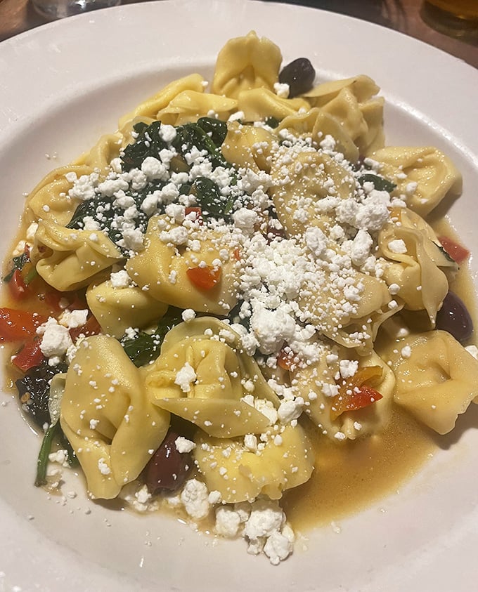 Tortellini wearing ricotta like pearls, because even pasta knows how to dress for dinner properly.