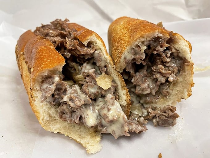 The cross-section reveals the truth: perfectly melted cheese embracing every morsel of seasoned beef—a sandwich that keeps its promises.