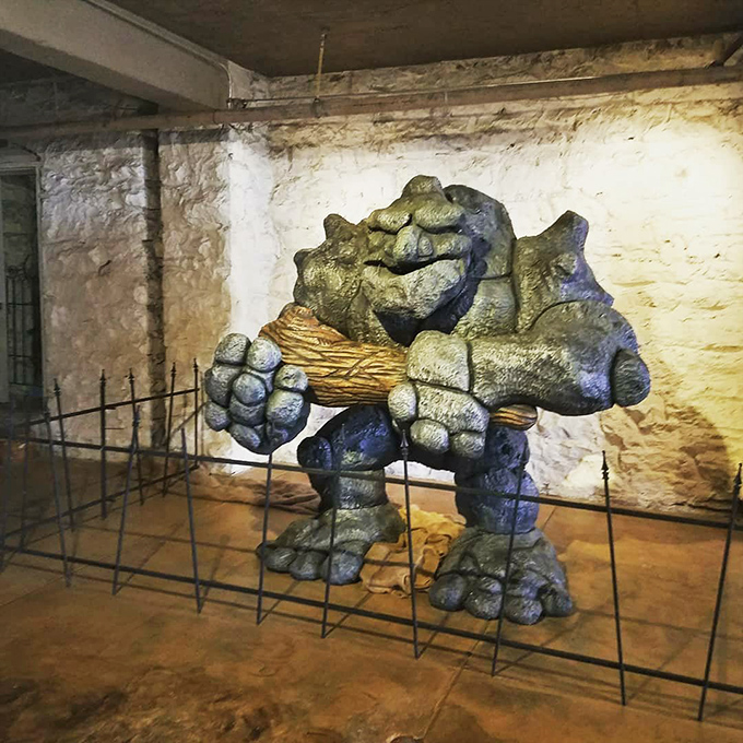 This basement troll sculpture looks like he's waiting for billy goats to cross his bridge—or perhaps just wondering why humans keep taking his picture.