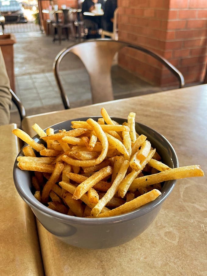 These truffle fries aren't just golden—they're the Olympic champions of side dishes, seasoned with enough umami to make your taste buds stand at attention.