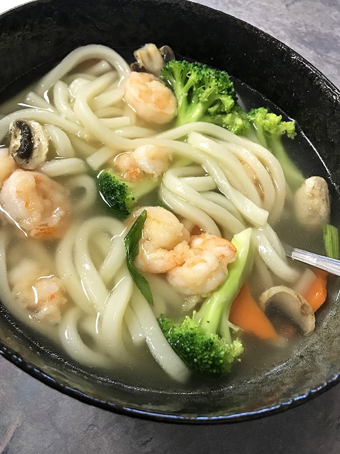 A soup that speaks volumes – clear broth with plump shrimp and udon noodles thick enough to satisfy but tender enough to slurp with dignity.