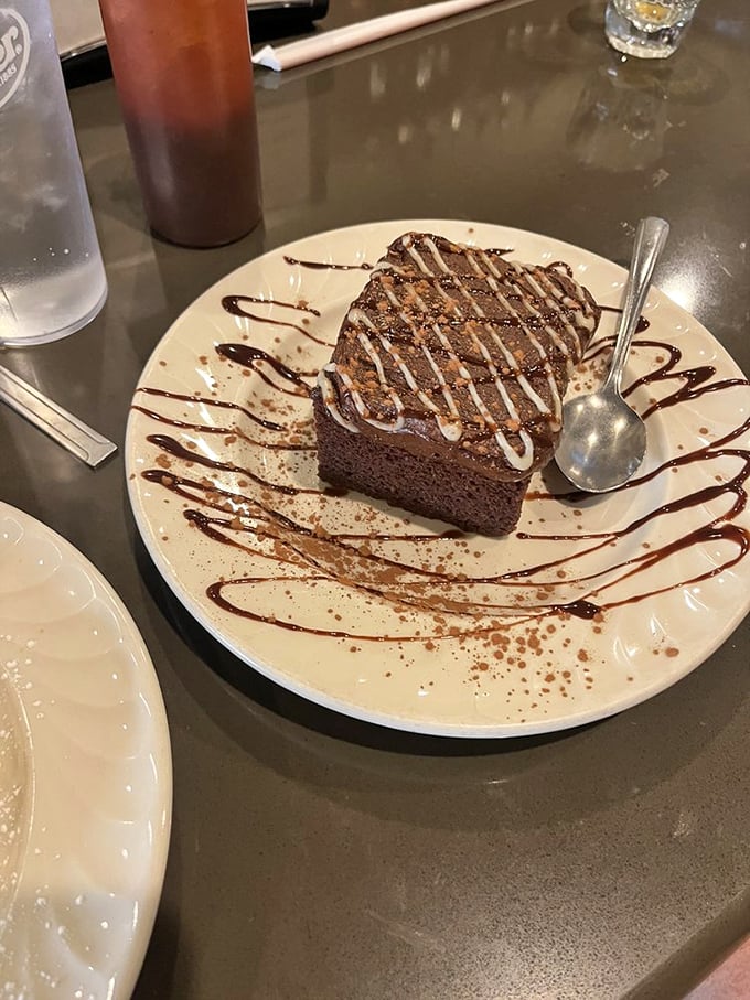 Chocolate cake that's somehow vegan yet decadently rich. Those sauce drizzles aren't just decoration—they're edible calligraphy.