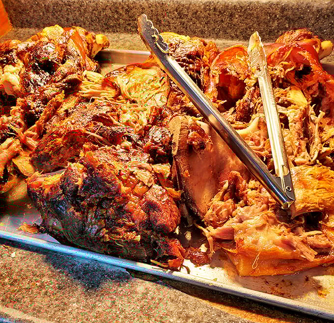 Behold the star of the show – slow-smoked pork that's been coaxed to perfection over hours, ready to make your taste buds stand at attention.