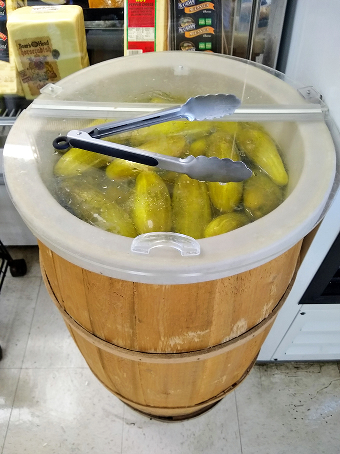 That barrel of pickles isn't just a condiment station – it's a vinegary treasure chest of crunchy, garlicky goodness.