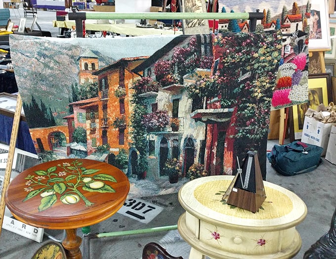 Someone's discarded painting becomes another's living room masterpiece—that Mediterranean village scene just waiting for its forever wall.
