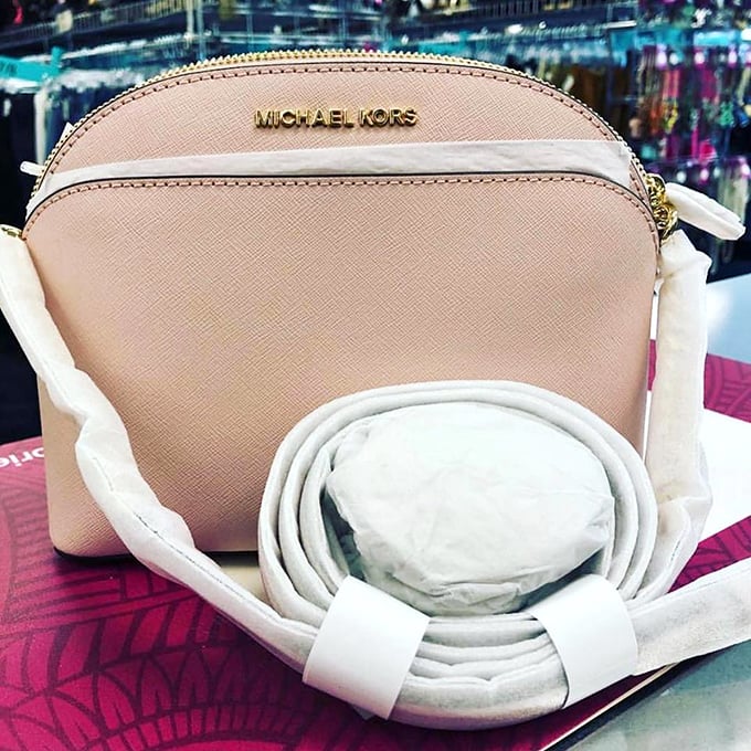 A Michael Kors bag that looks barely touched – the fashion equivalent of finding an unopened vintage wine at a yard sale.