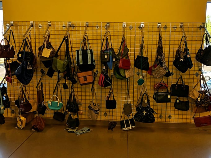 Handbag heaven on a sunny yellow wall. Designer labels mingle with practical totes, all waiting for a second chance to make a first impression.