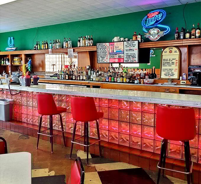 The bar area glows with neon signs and decades of stories – if these walls could talk, they'd probably order another round.