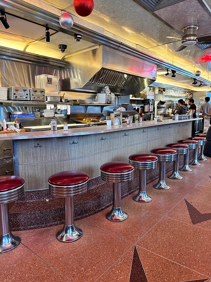 Counter seats: front-row tickets to the greatest show on earth – short-order cooks performing culinary ballet on the griddle.