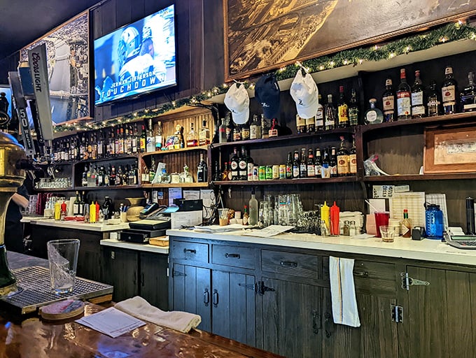 Behind the bar, bottles stand at attention like soldiers guarding the secret to a perfect evening of food, drinks, and zero pretension.