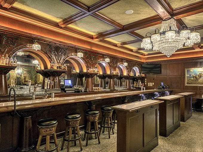 A bar that would make Don Draper feel at home—crystal chandeliers hanging above meticulously crafted Manhattans and whiskey neat.
