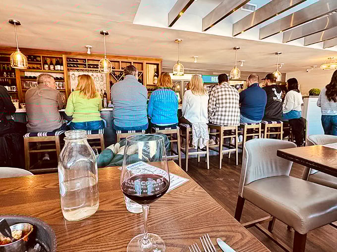 The bustling bar area hums with conversation and clinking glasses – the heartbeat of Bluecoast's convivial atmosphere.