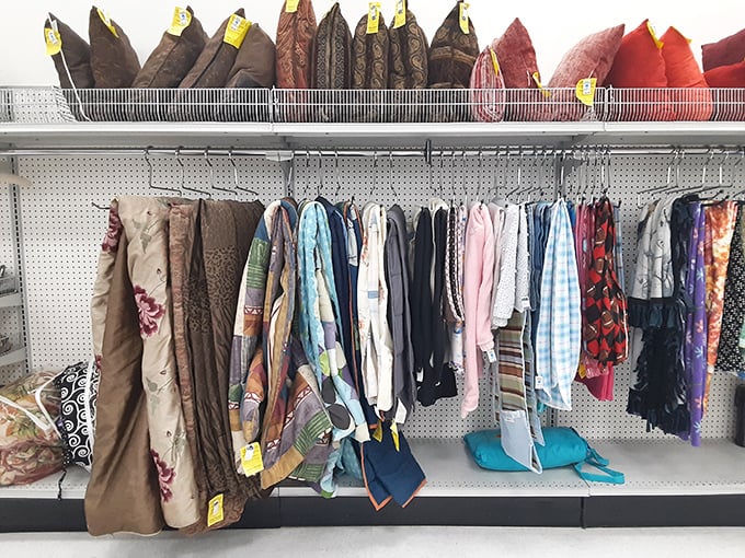 Curtains, tablecloths, and bedding galore—textile treasures hanging like colorful flags in this fabric United Nations.