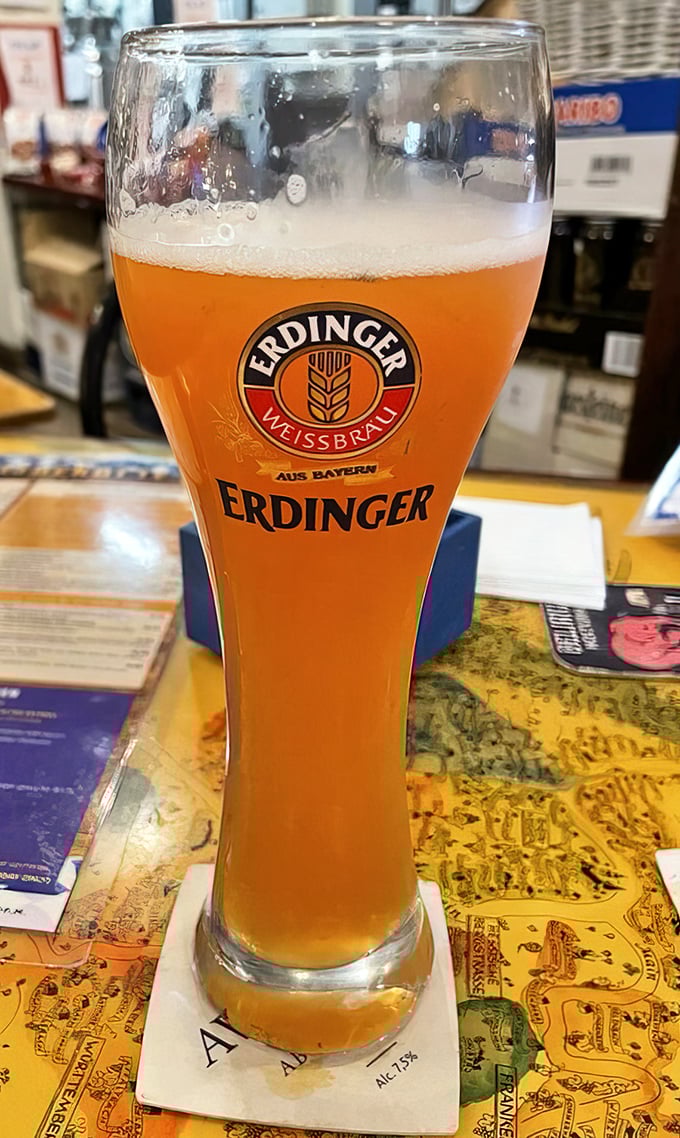 An Erdinger Weissbier standing tall and proud – liquid sunshine in a glass that practically yodels with every sip.