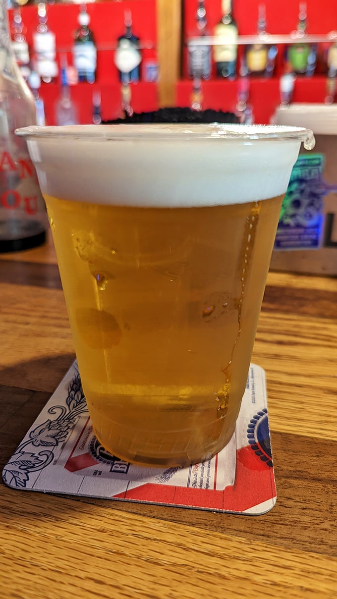 A cold beer in a plastic cup – the universal symbol for "relax, you're among friends now." Simple pleasures are often the most profound.