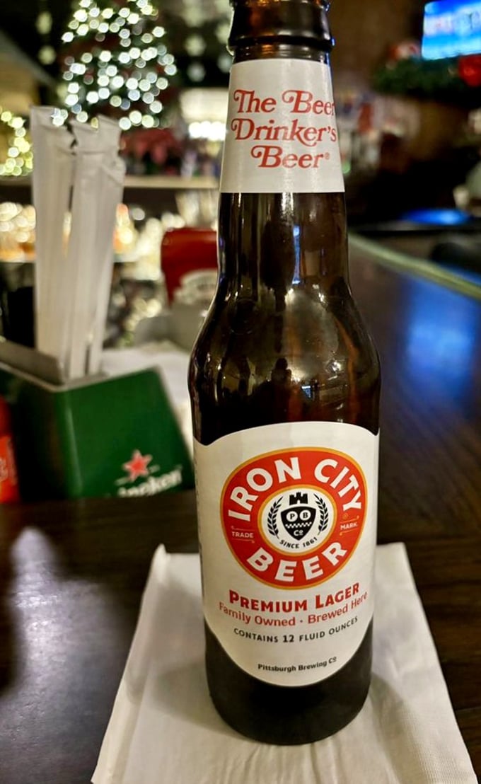Iron City Beer—Pittsburgh's liquid handshake. The perfect companion for a sandwich that demands local respect.