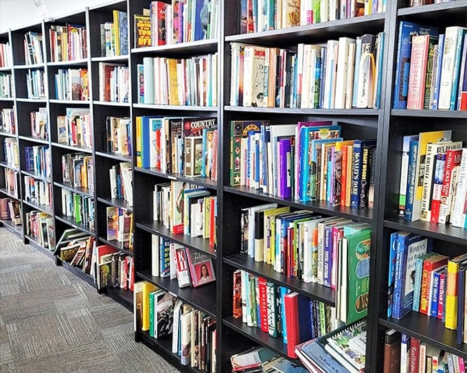 Floor-to-ceiling bookshelves packed with colorful spines – a bibliophile's dream where $25 could build a respectable home library from scratch.