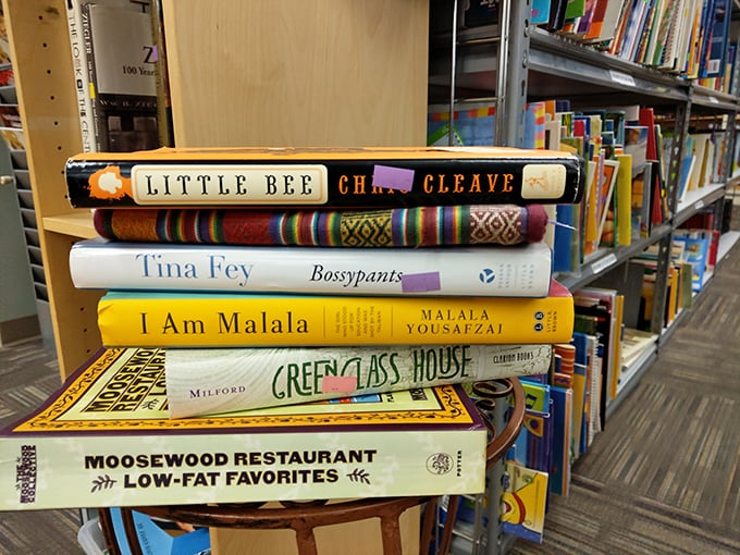 Literary treasures stacked like a time capsule of American culture – from Tina Fey's wit to Malala's wisdom, all waiting for new shelves.