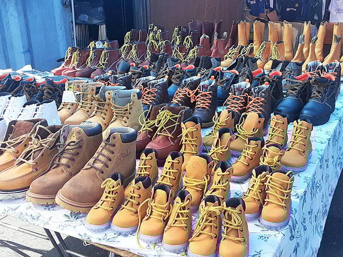 Work boots lined up like soldiers ready for duty, offering foot protection that won't leave your bank account limping.