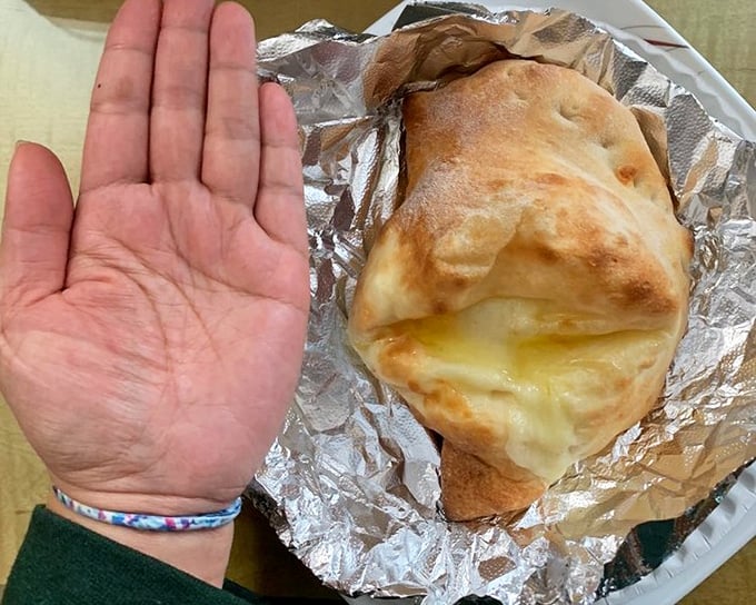 The calzone – pizza's mysterious cousin who keeps all the good stuff hidden inside, like a delicious secret agent.