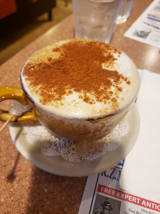 This isn't just coffee – it's a cappuccino wearing a cinnamon suit, ready for its close-up on the cover of "Beverages Monthly."
