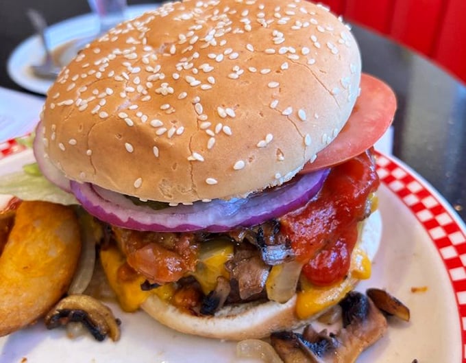 A burger that requires a game plan before the first bite. Those mushrooms and melted cheese aren't just toppings—they're a flavor committee.
