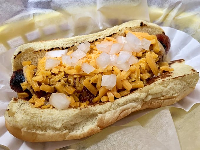 The coleslaw-topped dog brings a refreshing crunch to the party. It's like putting a Hawaiian shirt on your hot dog – unexpectedly perfect.