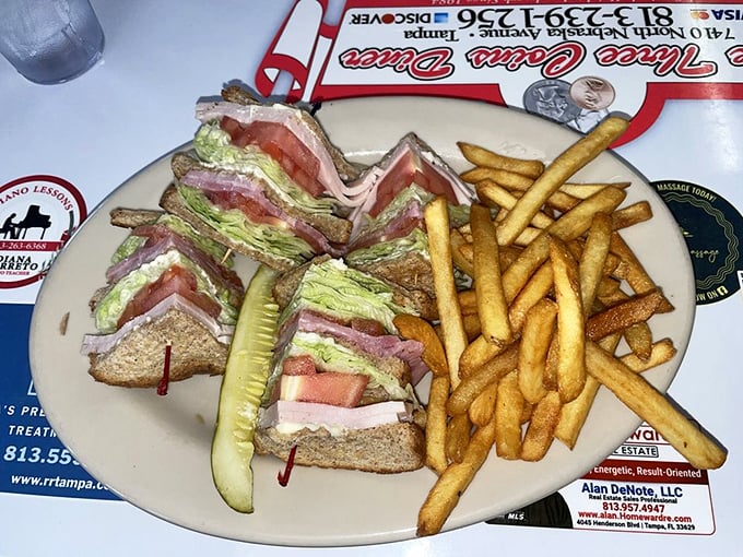 The club sandwich—architecture you can eat. Layers of satisfaction held together by those little toothpicks of hope.