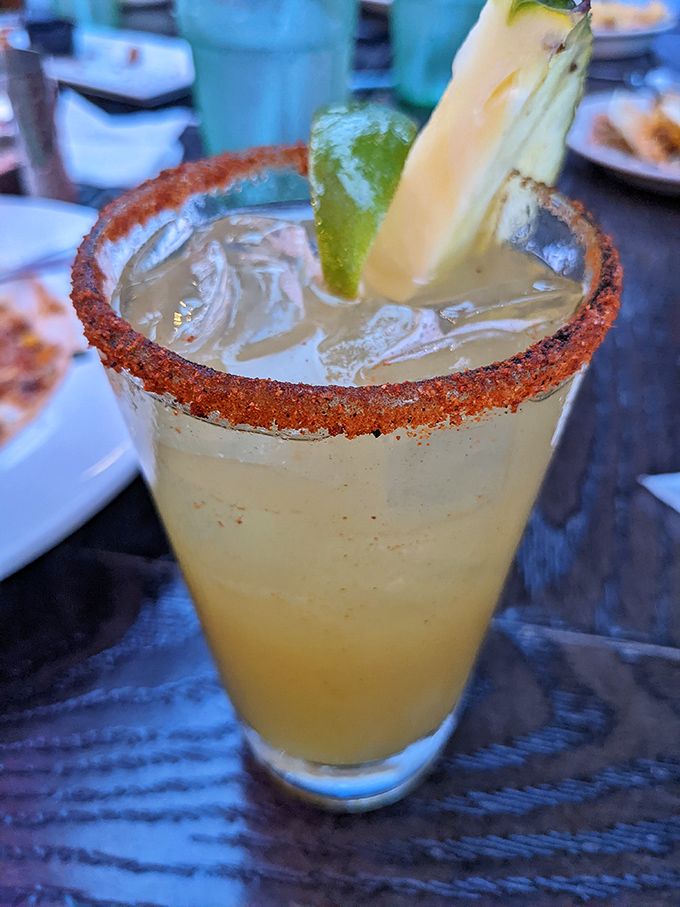 That rim isn't just for show—it's packing enough spice to make you forget you're drinking something that could double as a vacation postcard.