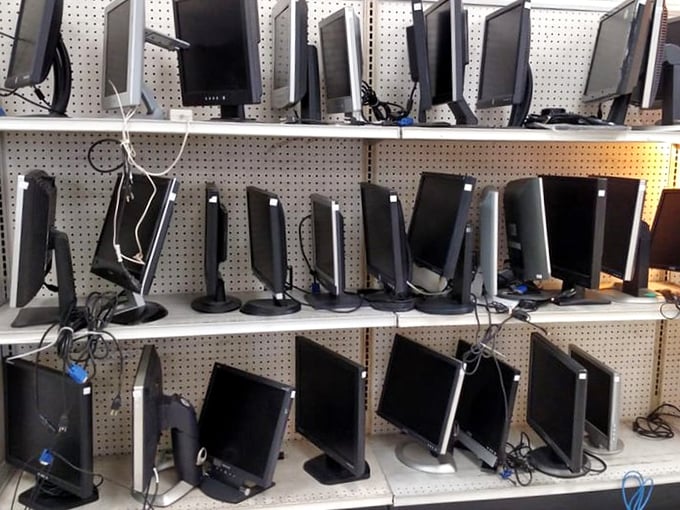 Computer monitors standing at attention, ready to serve someone's home office without destroying their checking account balance.