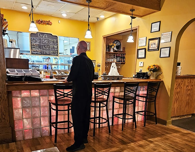 Where magic happens—the bar area offers front-row seats to culinary craftsmanship and casual conversation.