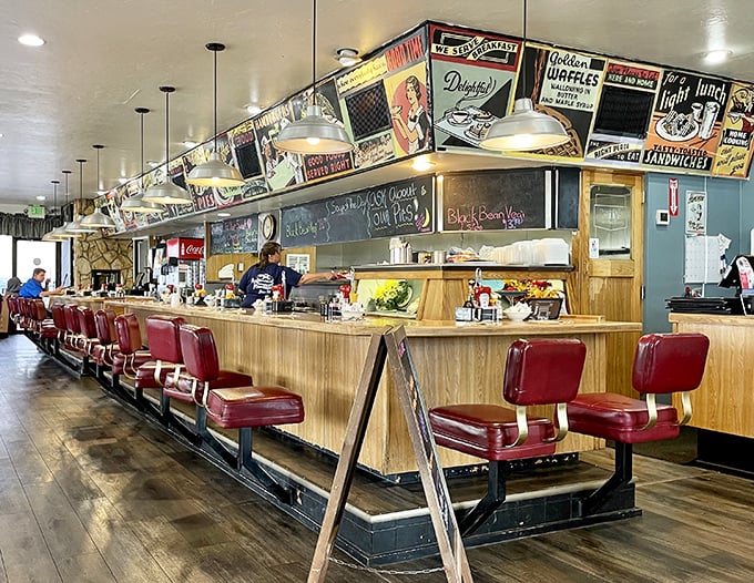 The counter seating – where solo diners become temporary family and the red vinyl stools have heard more Nevada stories than any barstool in Reno.
