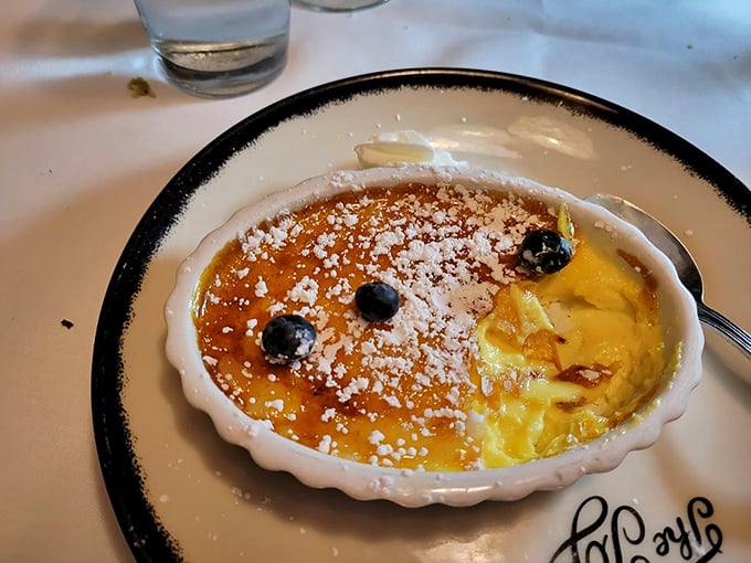 Crème brûlée with the perfect crackling top—like breaking into a sugar vault where custard gold awaits underneath.