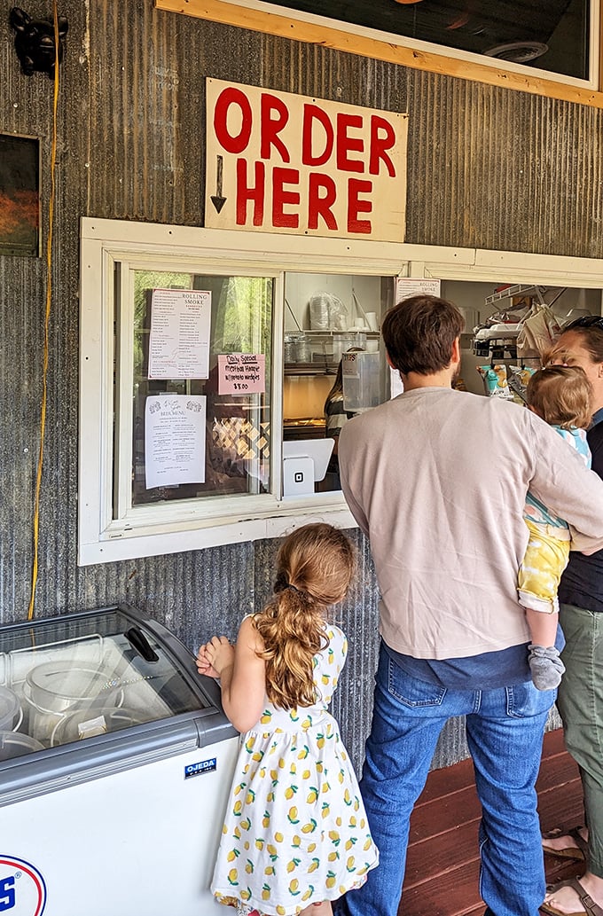The "ORDER HERE" window—where dreams come true and diets go to die. Worth every delicious calorie.