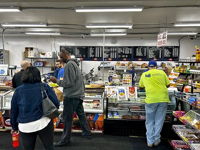 The lunchtime rush at Malin's – where hungry customers patiently wait their turn for sandwich greatness.